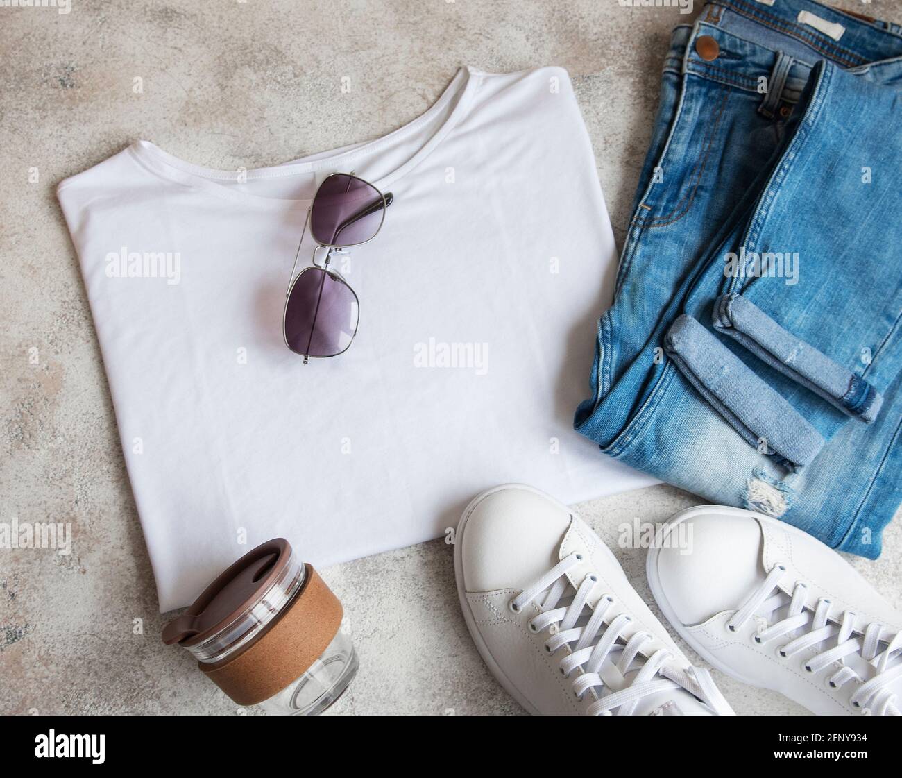 Stylish female clothes set. Woman outfit on concrete background. Blue ...