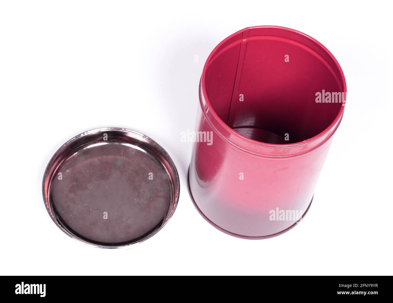 Old pink tin can, isolated on white background Stock Photo - Alamy