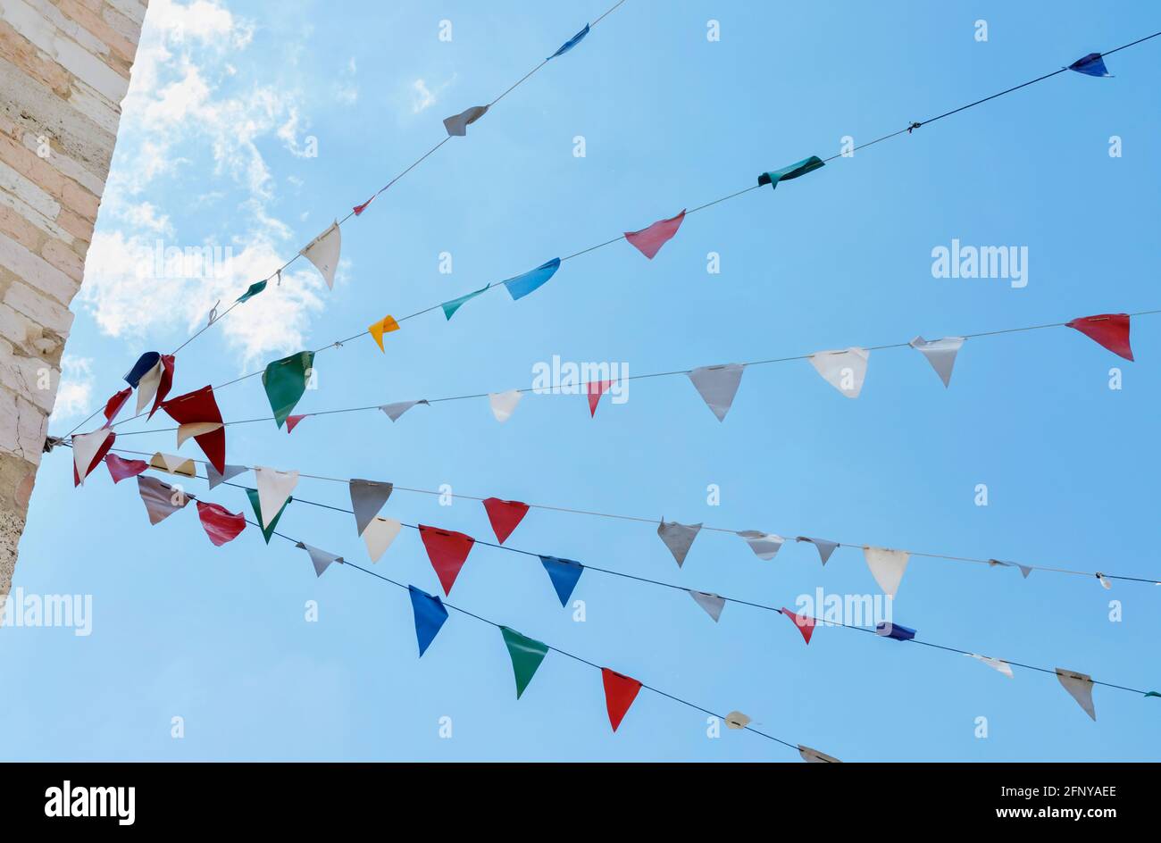 Strings of colored bunting flags Stock Photo - Alamy