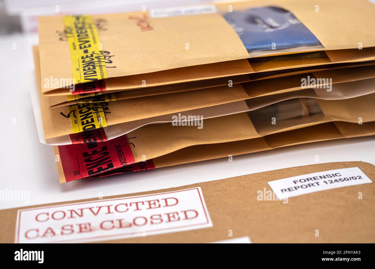 Files and evidence bag in a crime lab, conceptual image Stock Photo - Alamy
