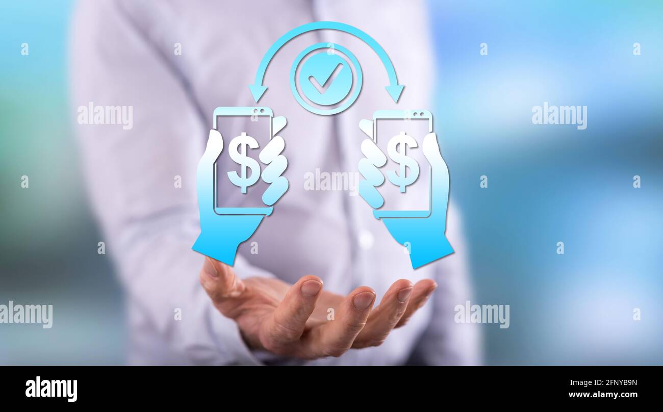 Money transfer concept above the hand of a man in background Stock ...