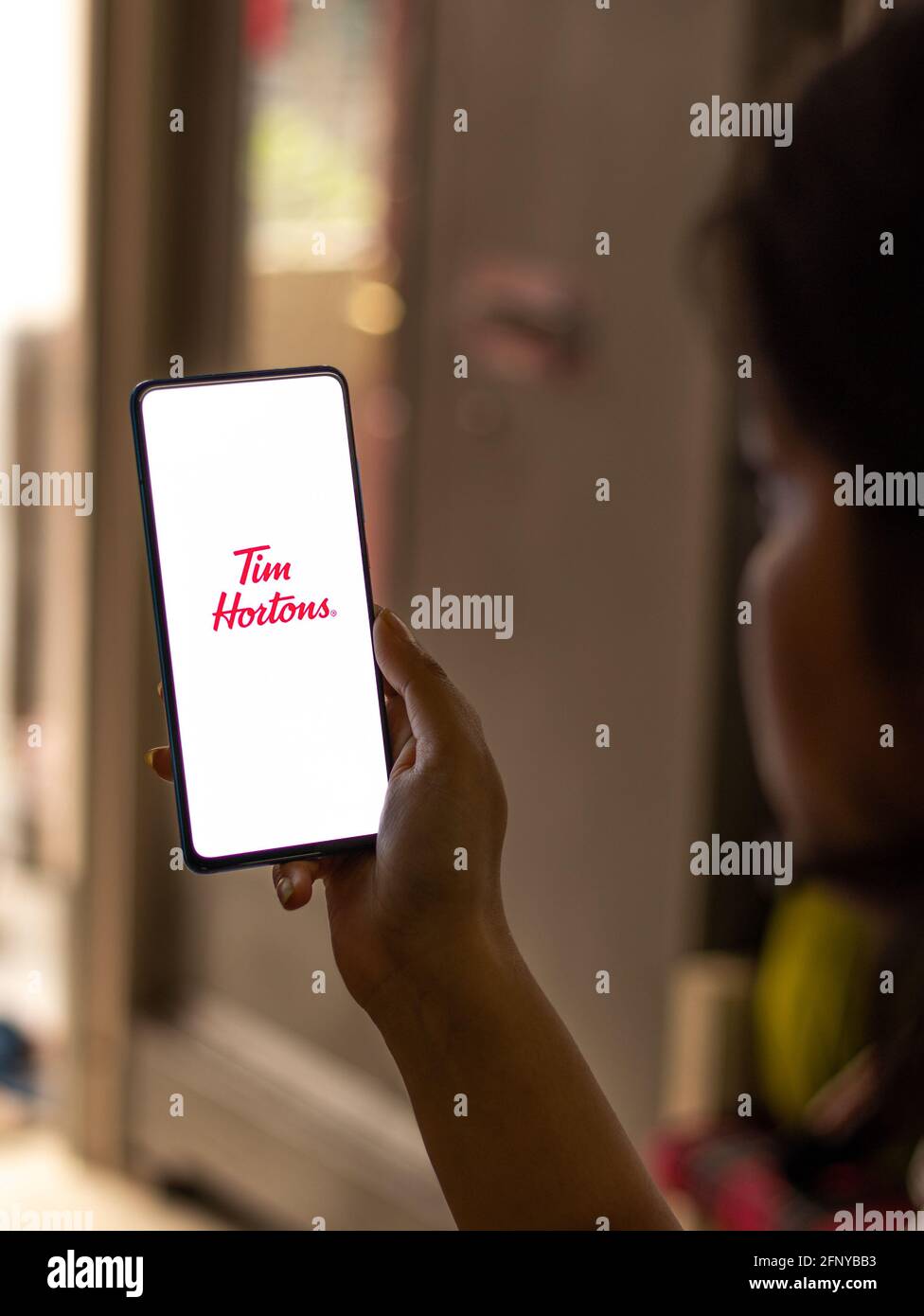Assam, india - May 18, 2021 : Tim Hortons logo on phone screen stock ...