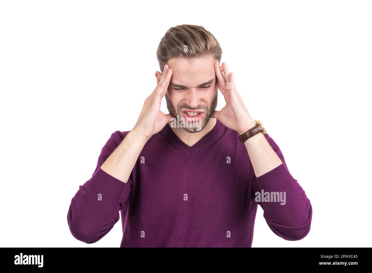 Distressed guy with closed eyes squeeze head with hands suffering from ...