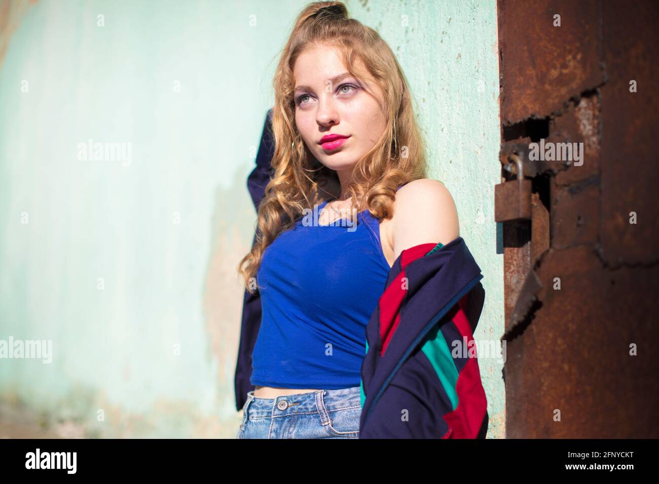 Beautiful girl in the style of the 90s in bright clothes Stock Photo ...