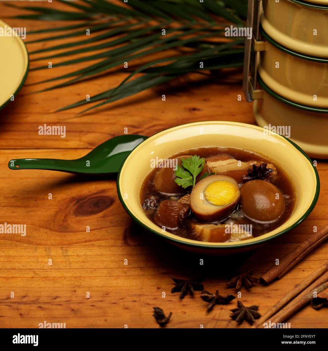 Close up view of sweet brown stewed eggs soup (Kai Palo) with pork on ...