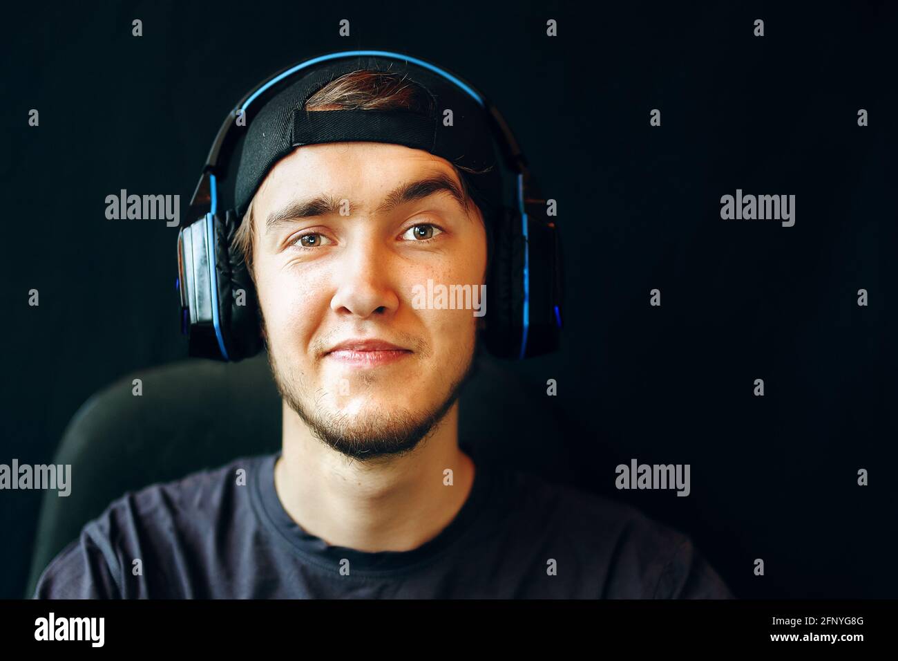 Cyber sport. Young handsome gamer trying hard to win a round. Streamer ...