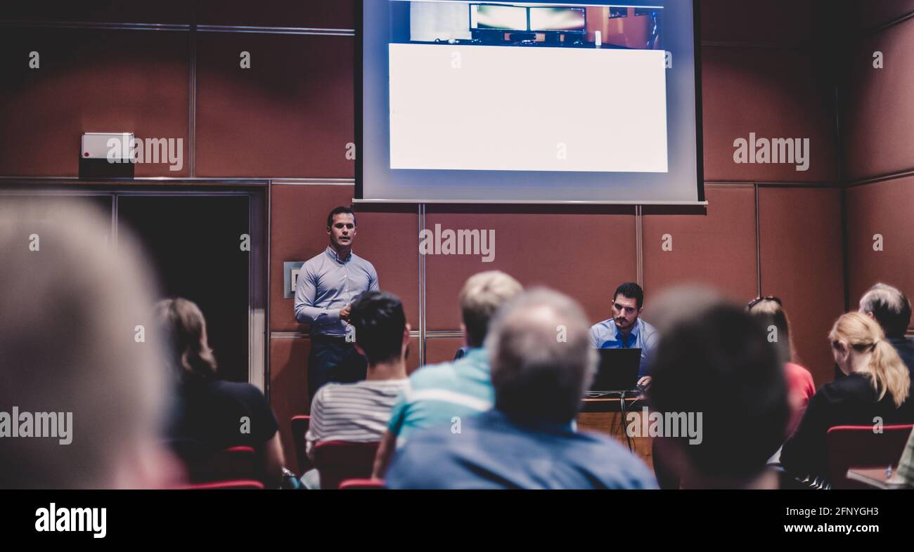 Business speaker giving talk at business conference event Stock Photo ...