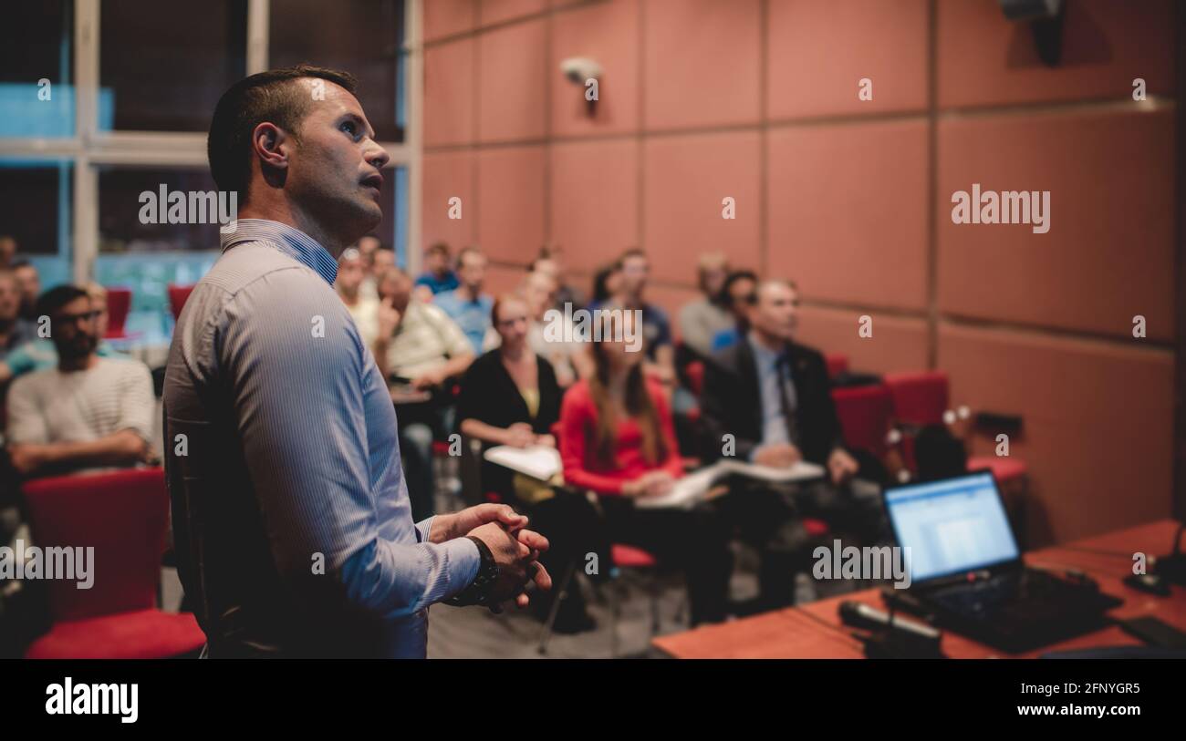 Public speaker giving talk at Business Event Stock Photo - Alamy
