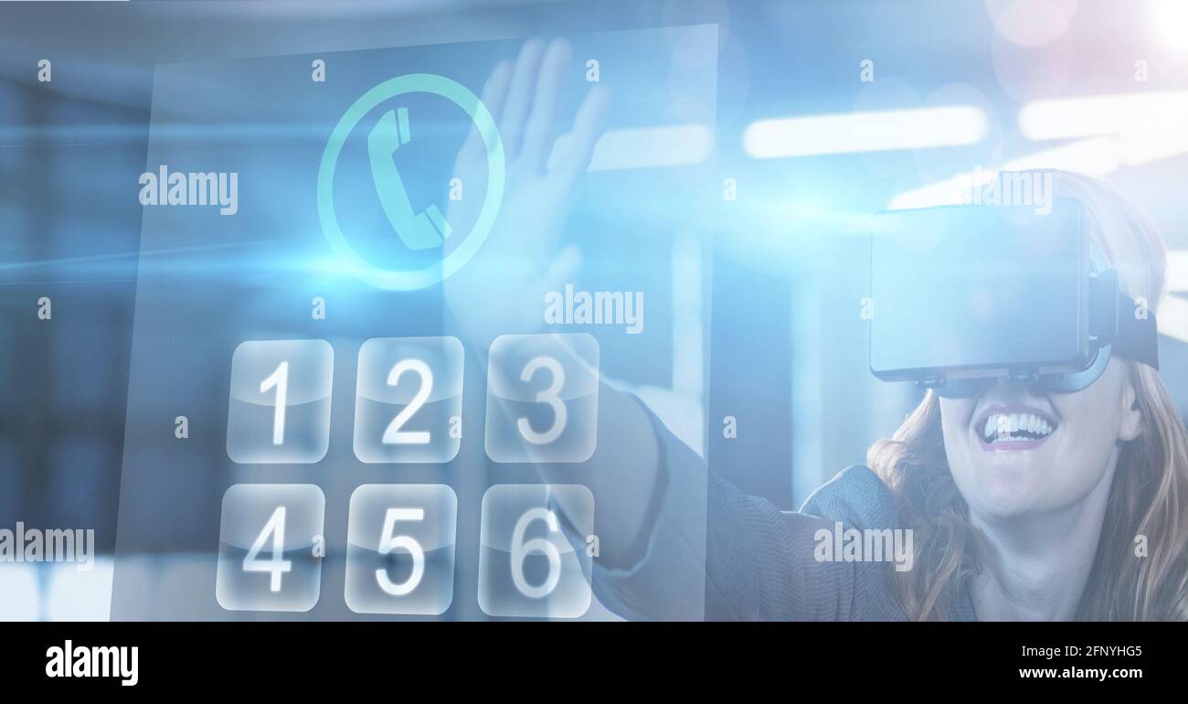 Composition of happy woman wearing vr headset touching digital phone ...
