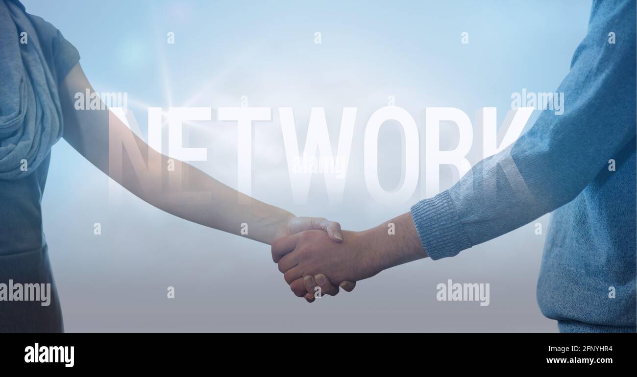 Network text against businessman and businesswoman shaking hands ...