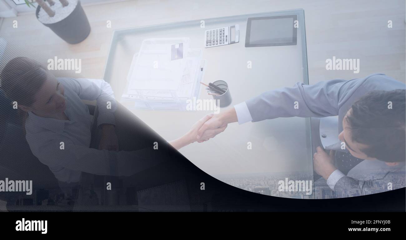 Composition of businessman and businesswoman shaking hands in office ...