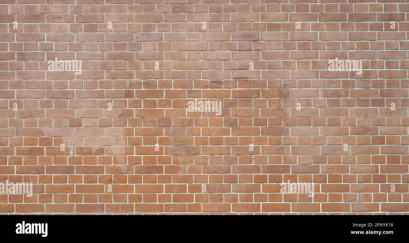 wide 4K red brick wall useful as a background Stock Photo - Alamy