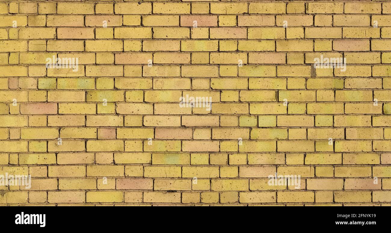 wide 4K yellow brick texture useful as a background Stock Photo - Alamy
