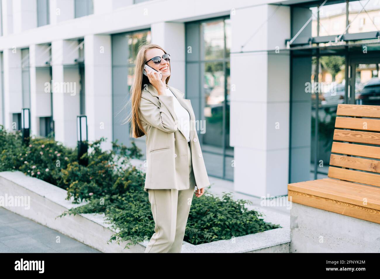 Woman blonde walking talking hi-res stock photography and images - Alamy