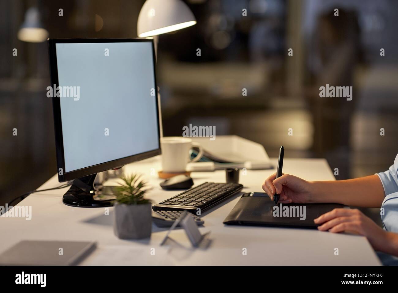 designer with computer and pen tablet at office Stock Photo - Alamy