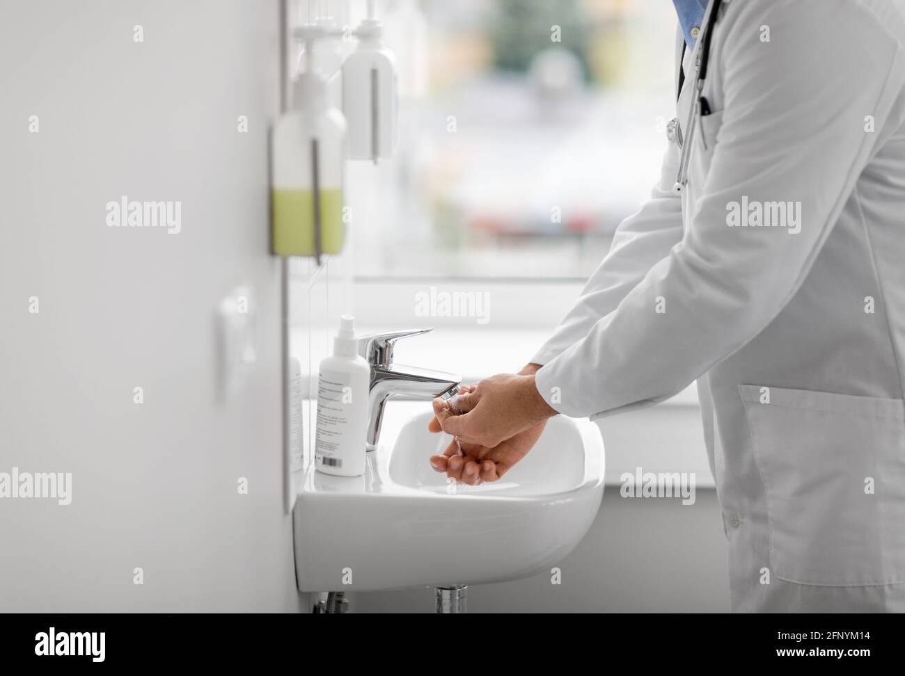 doctor washing hands at hospital sink Stock Photo - Alamy