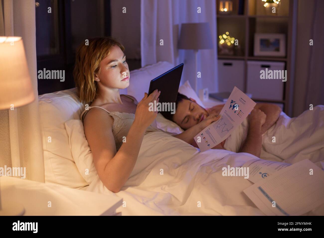 Woman computer night bed hi-res stock photography and images - Alamy