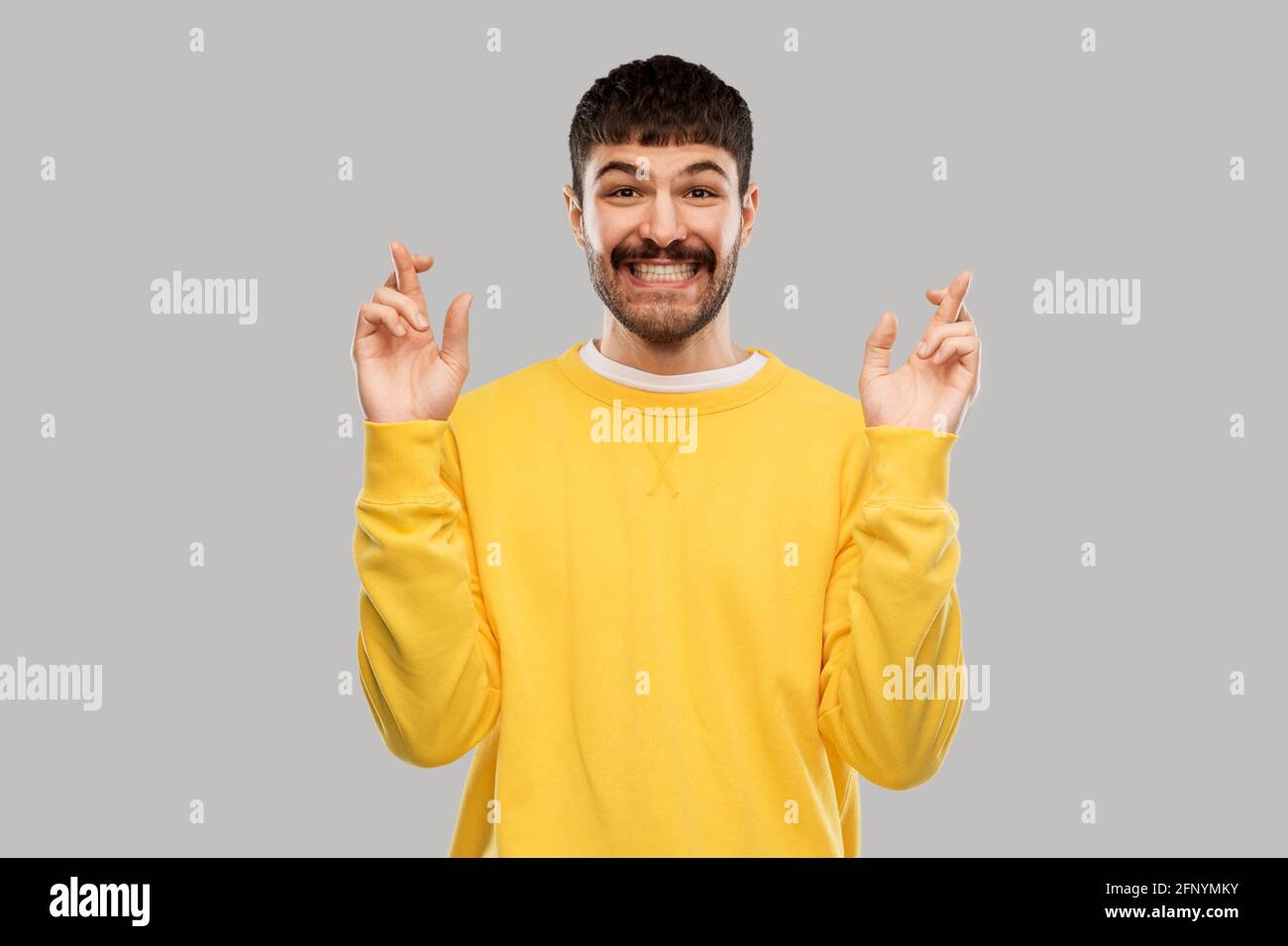Hand fingers crossed male hi-res stock photography and images - Alamy