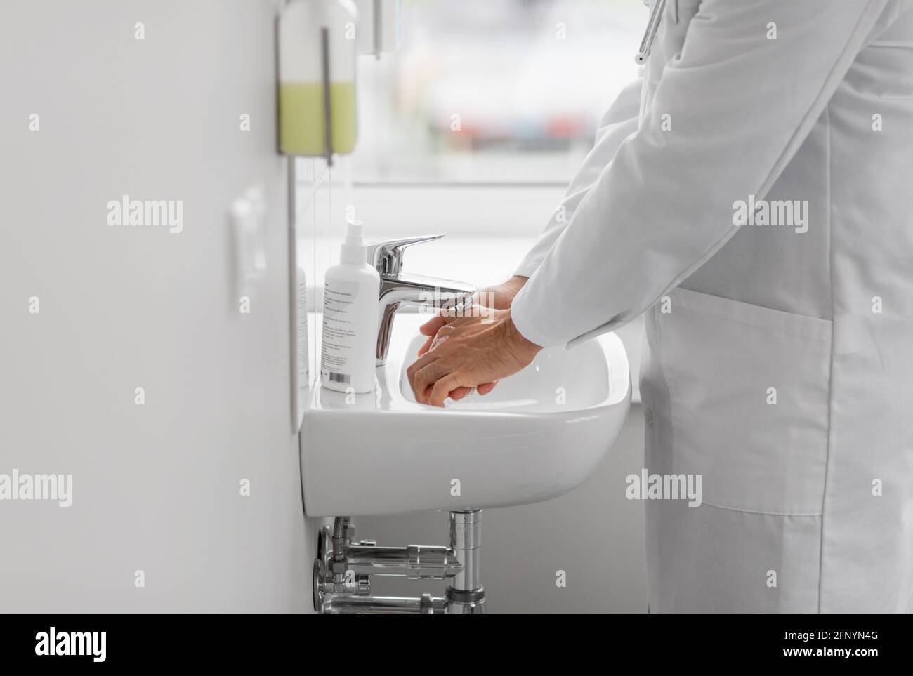 doctor washing hands at hospital sink Stock Photo - Alamy