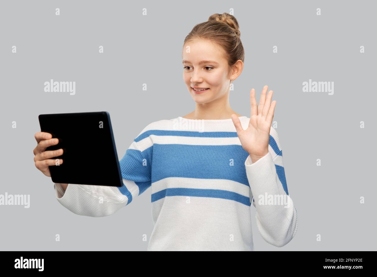 teenage girl with tablet pc having video call Stock Photo - Alamy