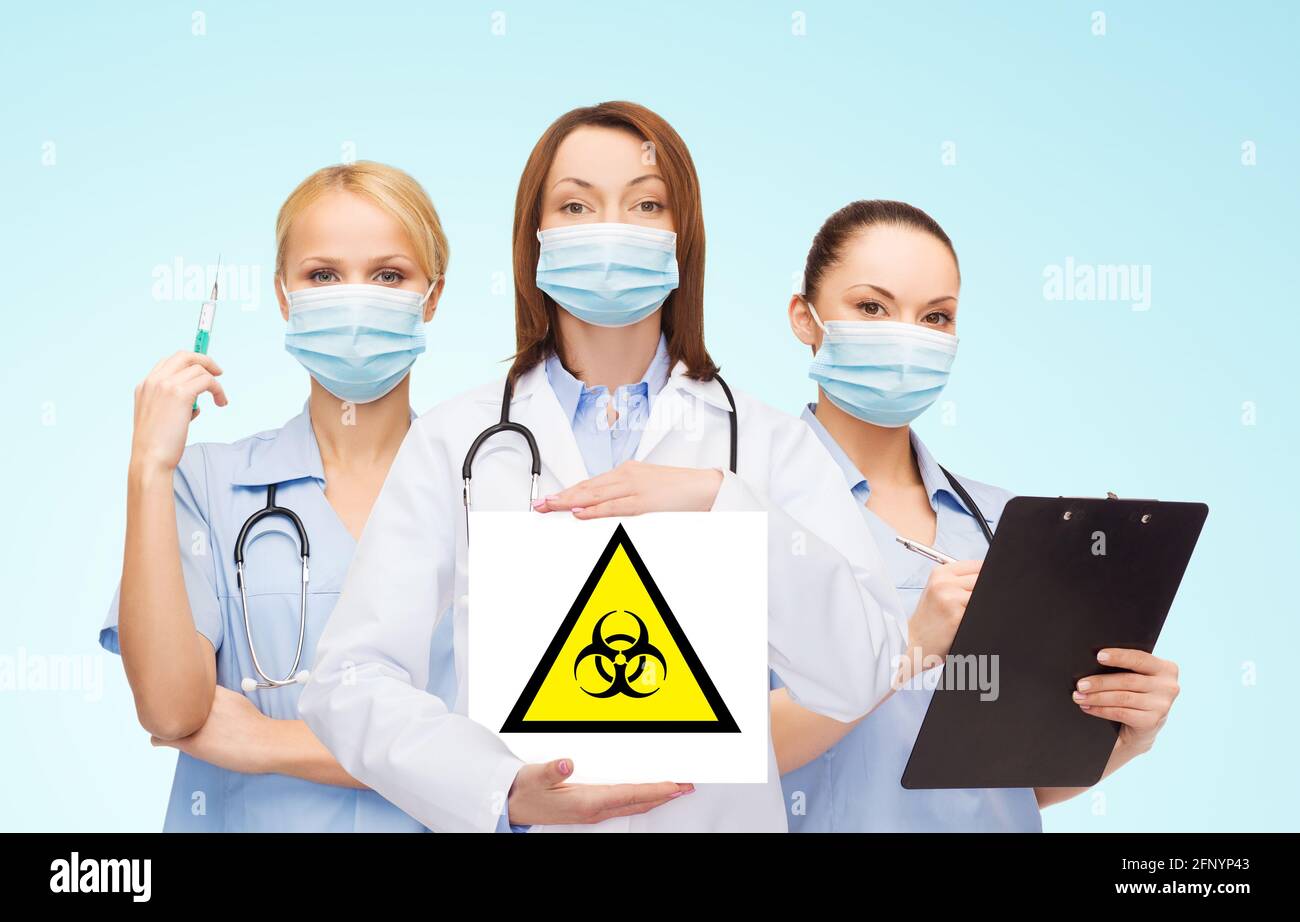 female doctor and nurses with biohazard sign Stock Photo - Alamy