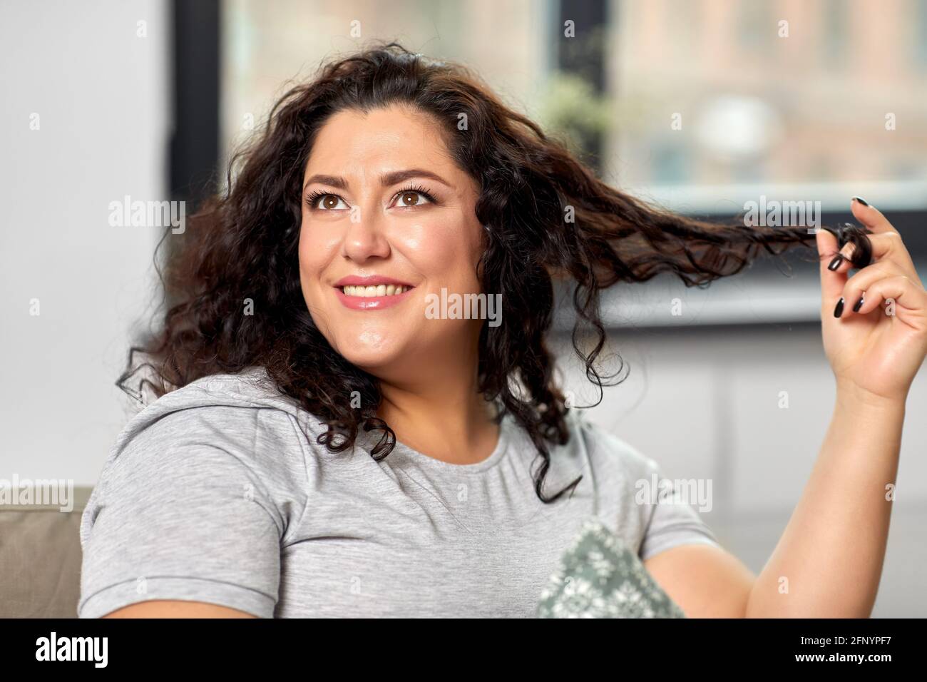 portrait of happy young woman at home Stock Photo - Alamy