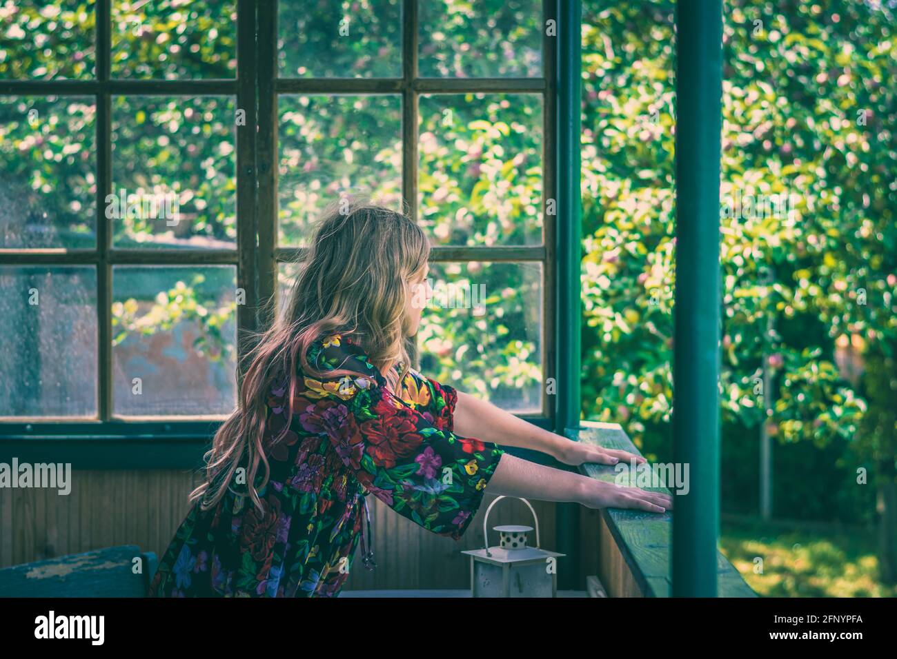 cute child in green romantic garden in romantic afternoon Stock Photo ...