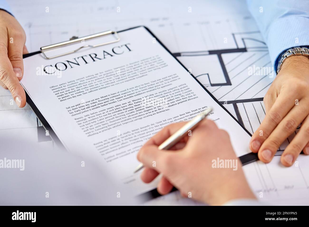 customer signing contract document at office Stock Photo - Alamy