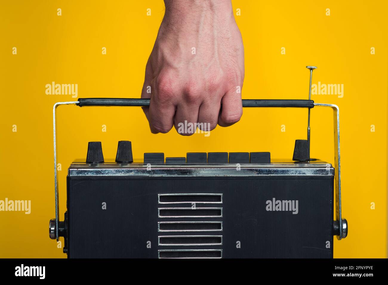 Hand of people takes away the old vintage radio Stock Photo - Alamy
