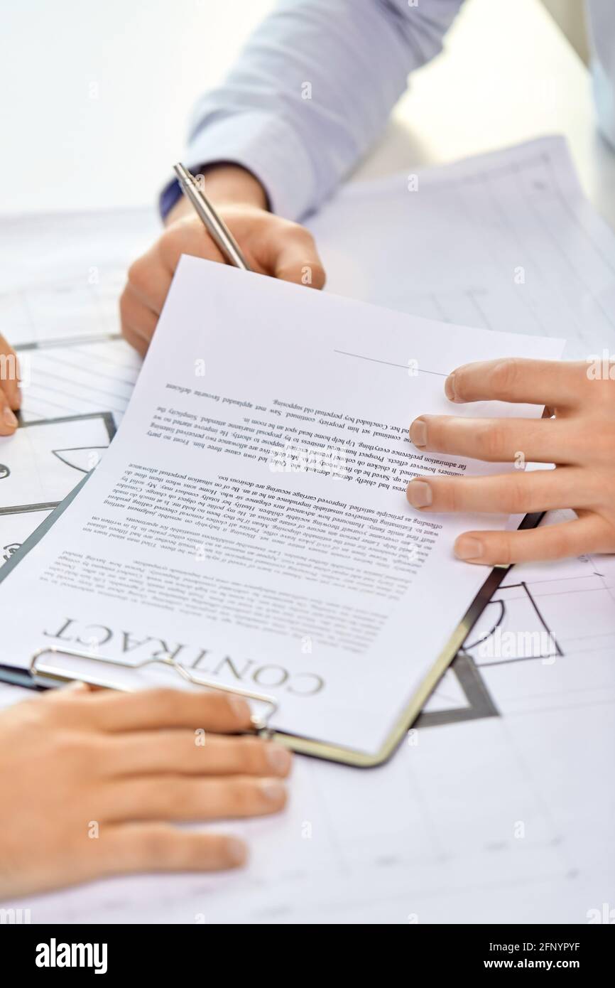 customer signing contract document at office Stock Photo - Alamy