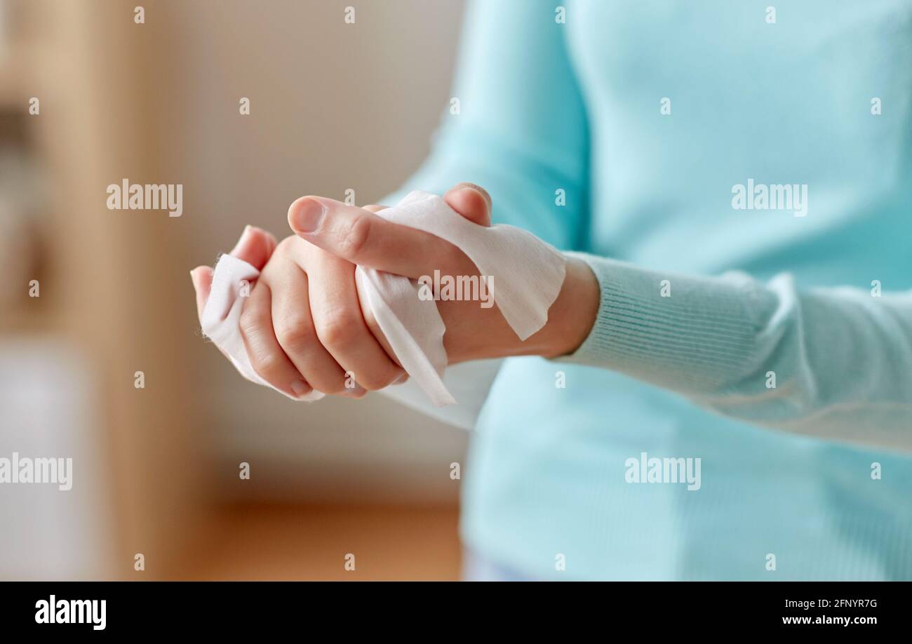 woman cleaning hands with antiseptic wet wipe Stock Photo - Alamy