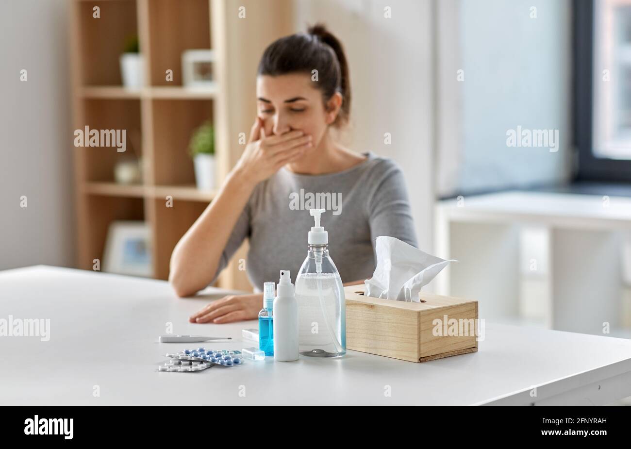 Sick young woman coughing sitting hi-res stock photography and images ...