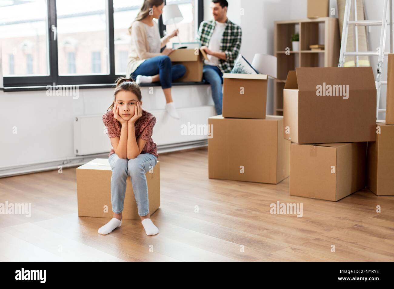 sad girl moving to new home with her family Stock Photo - Alamy