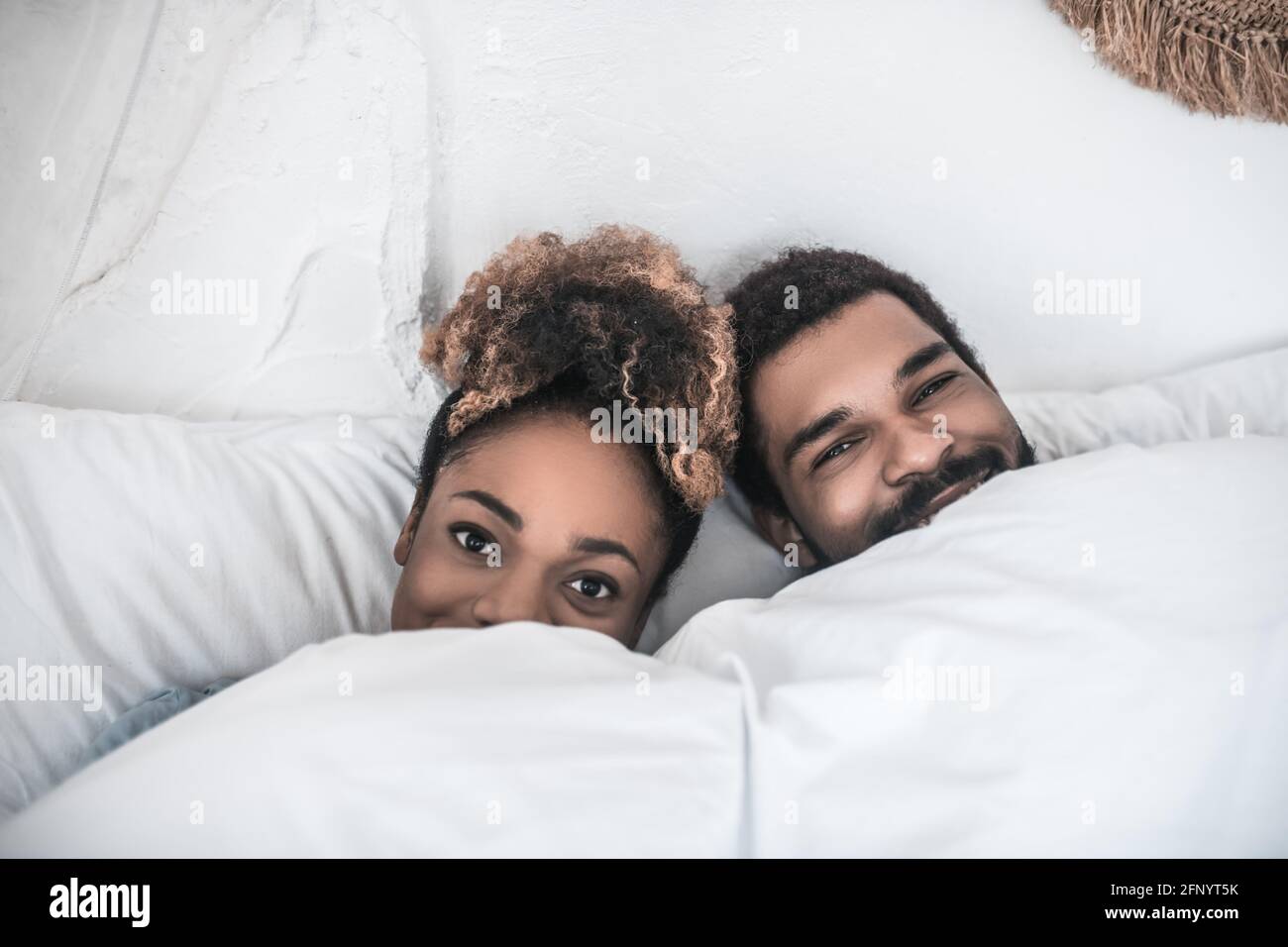 African american couple under blanket hi-res stock photography and ...