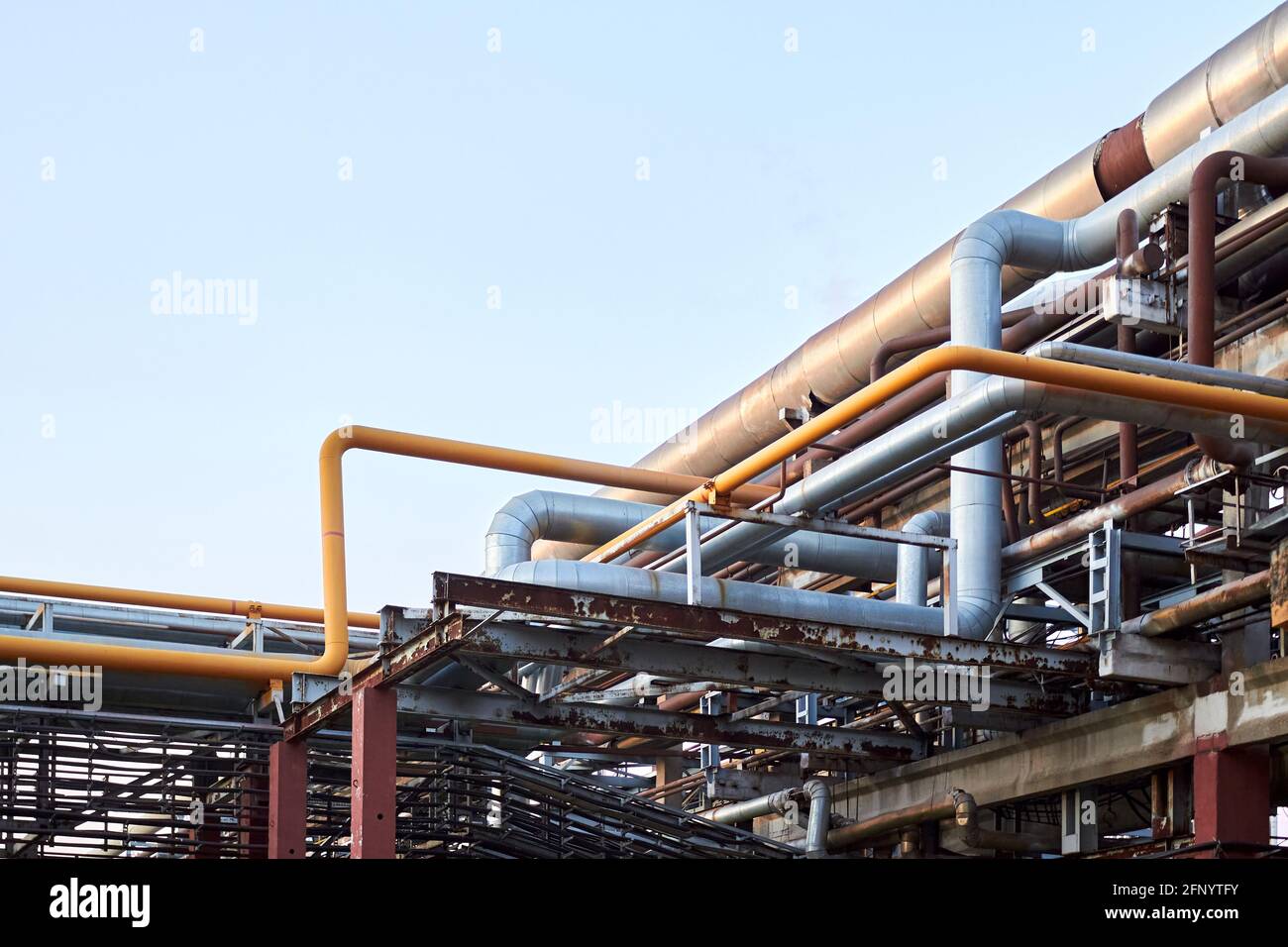 Pile of power cabels and steel pipes with gas, oxigen air rust covered ...