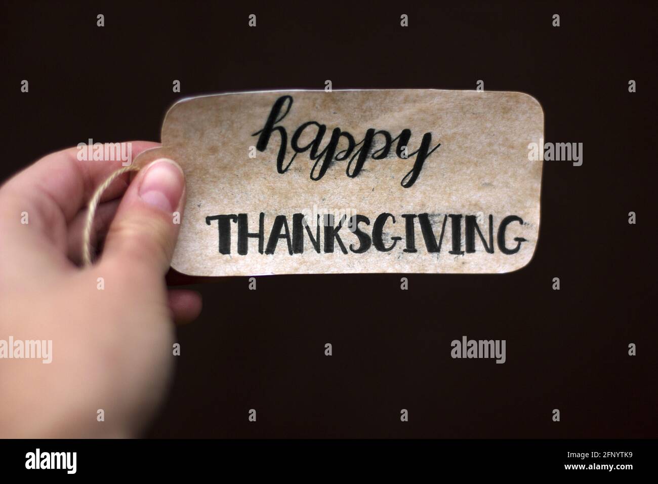 The inscription "Happy Thanksgiving" in the hand Stock Photo - Alamy