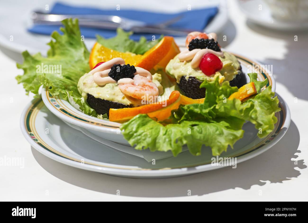 Plate of avocado filled shrimp cocktail Stock Photo - Alamy