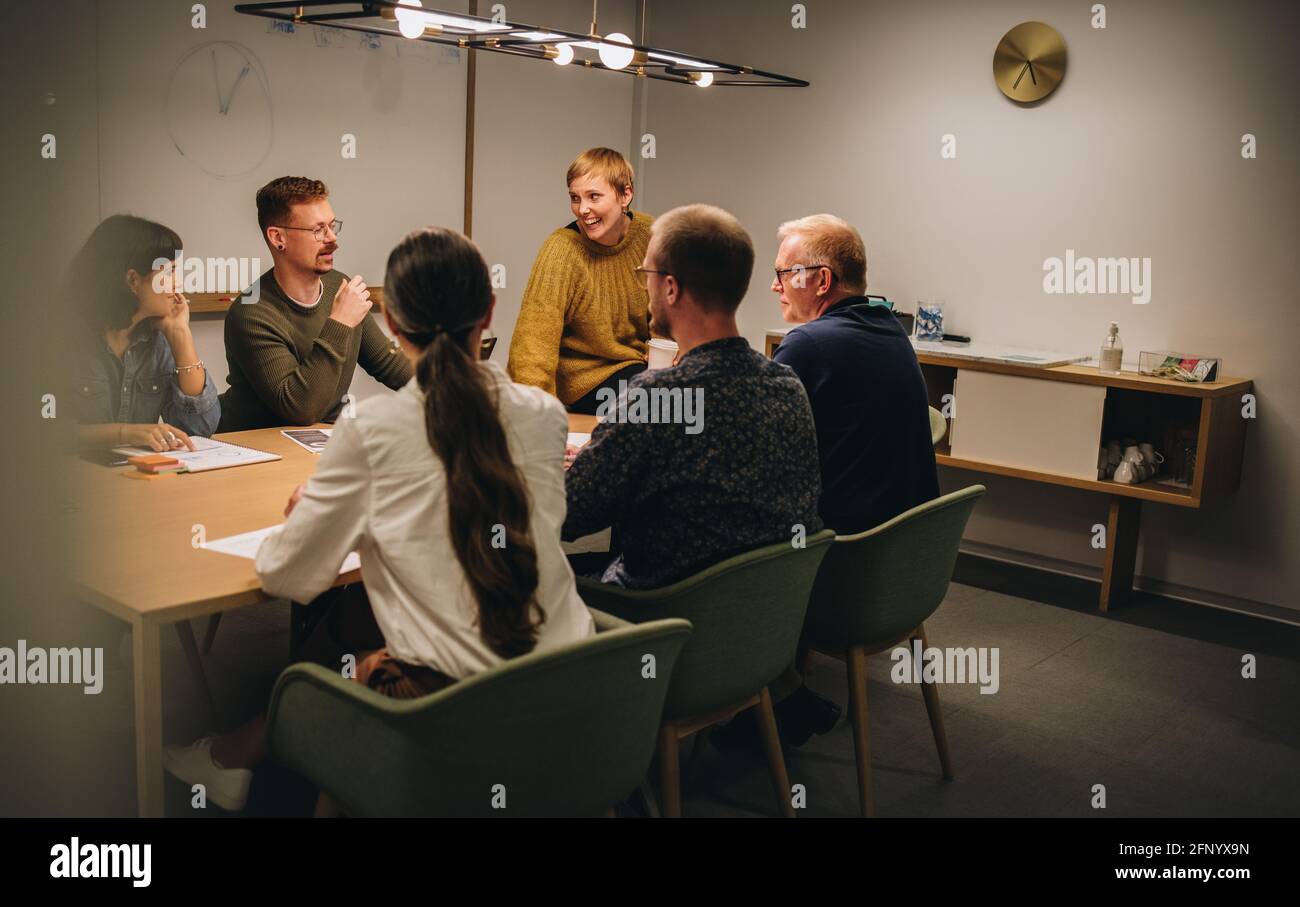 Executive speaking in board meeting of creative team. Man giving ...