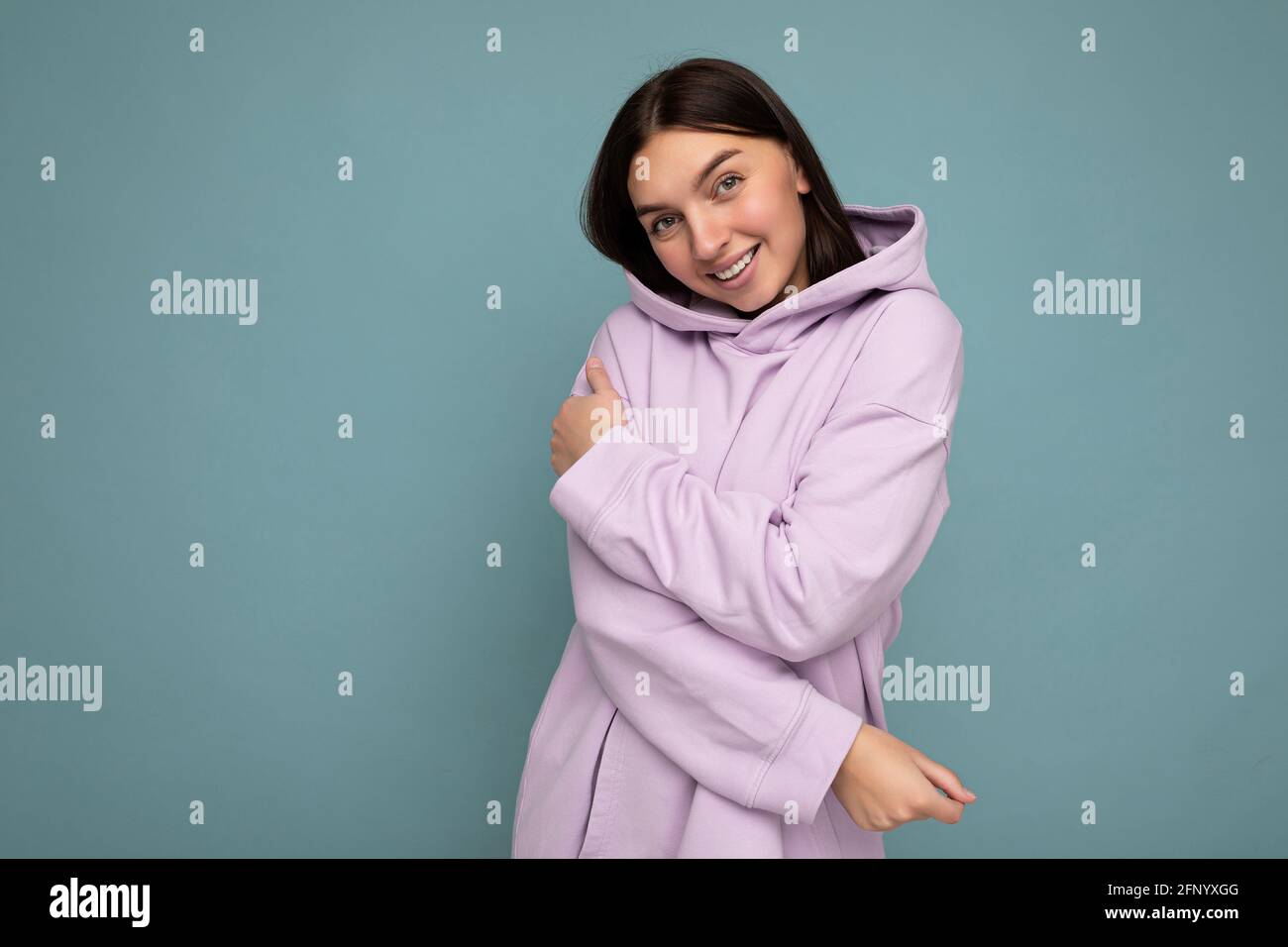 Smiling cute young beautiful brunette woman with sincere emotions ...