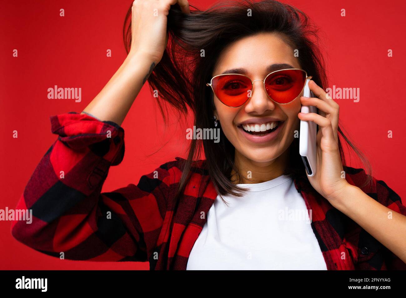 Closeup photo of attractive smiling positive young brunet woman wearing ...