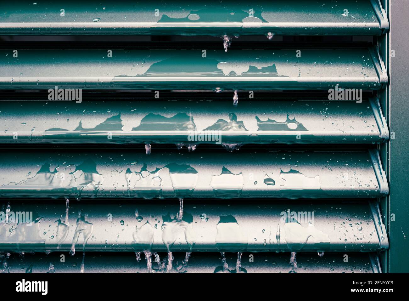 Raindrops and drip water on the shutter, detail Stock Photo - Alamy