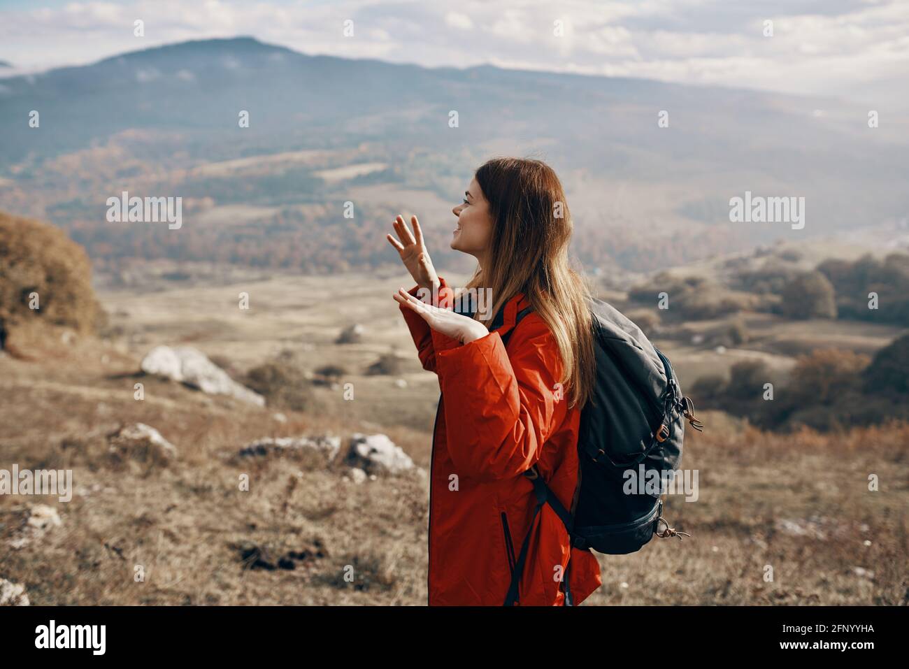 Travel woman with backpack rest in the mountains on nature landscape ...