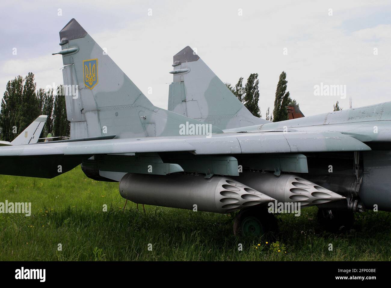 Modern war plane with disarmament rockets under wings at military base ...