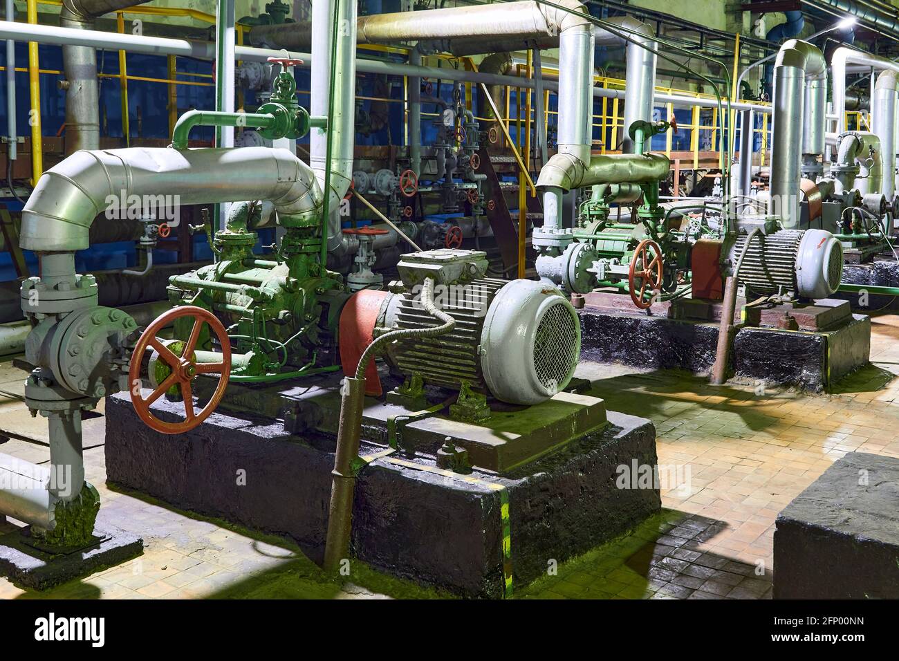 Petrochemical plant interior. Industrial centrifugal pumps of chemical ...