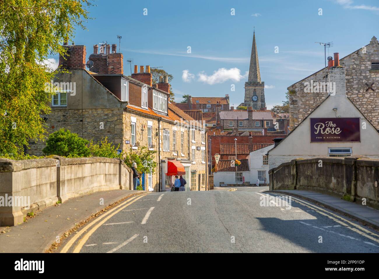 View of St Peter and St Paul Church and bridge over Pickering Beck ...