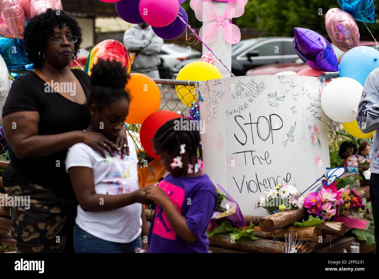 Demonstrators embrace while attending a vigil for Aniya Allen on May 19 ...