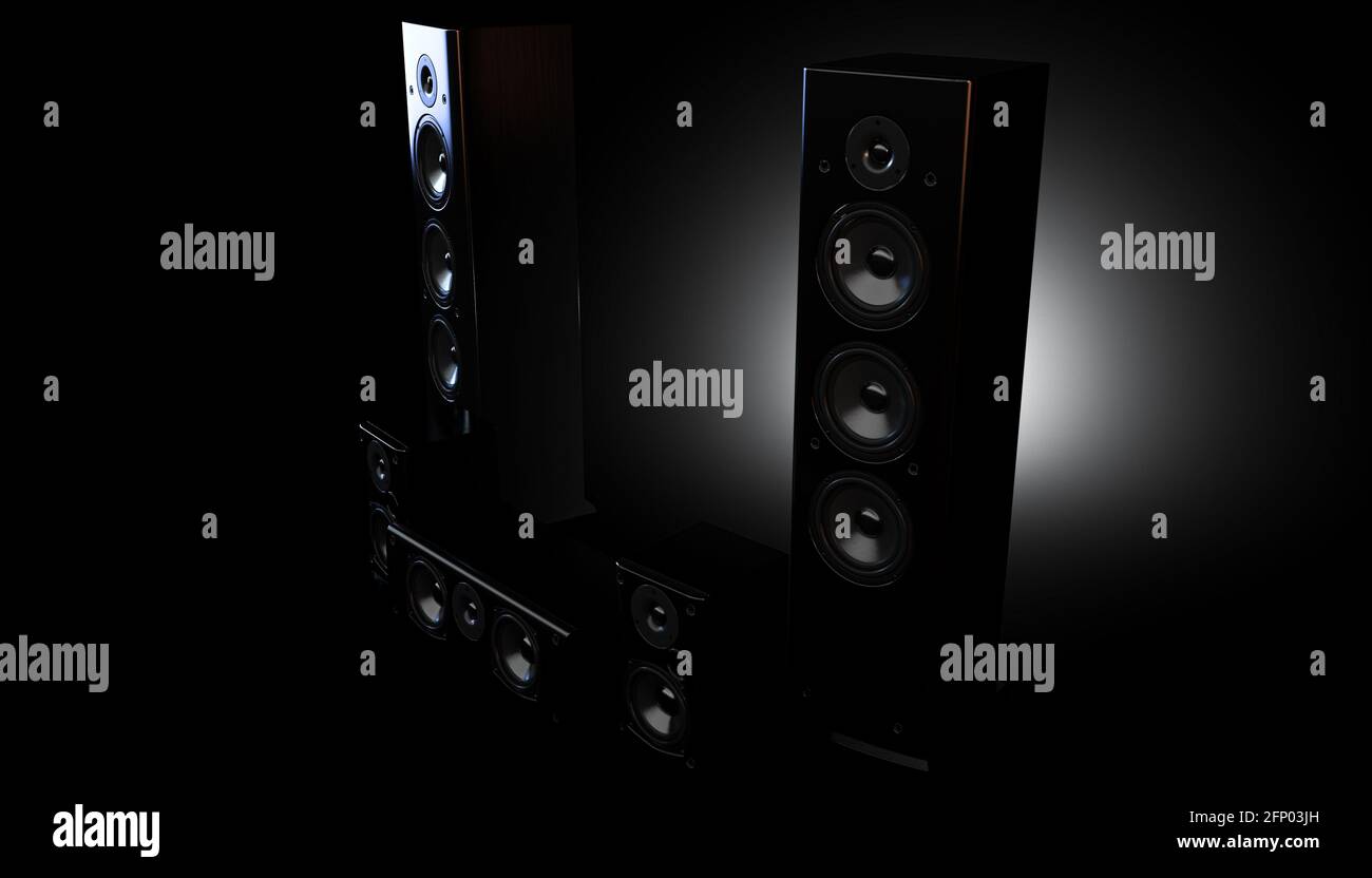 A modern surround sound speaker arrangment on a dark backlit studio ...