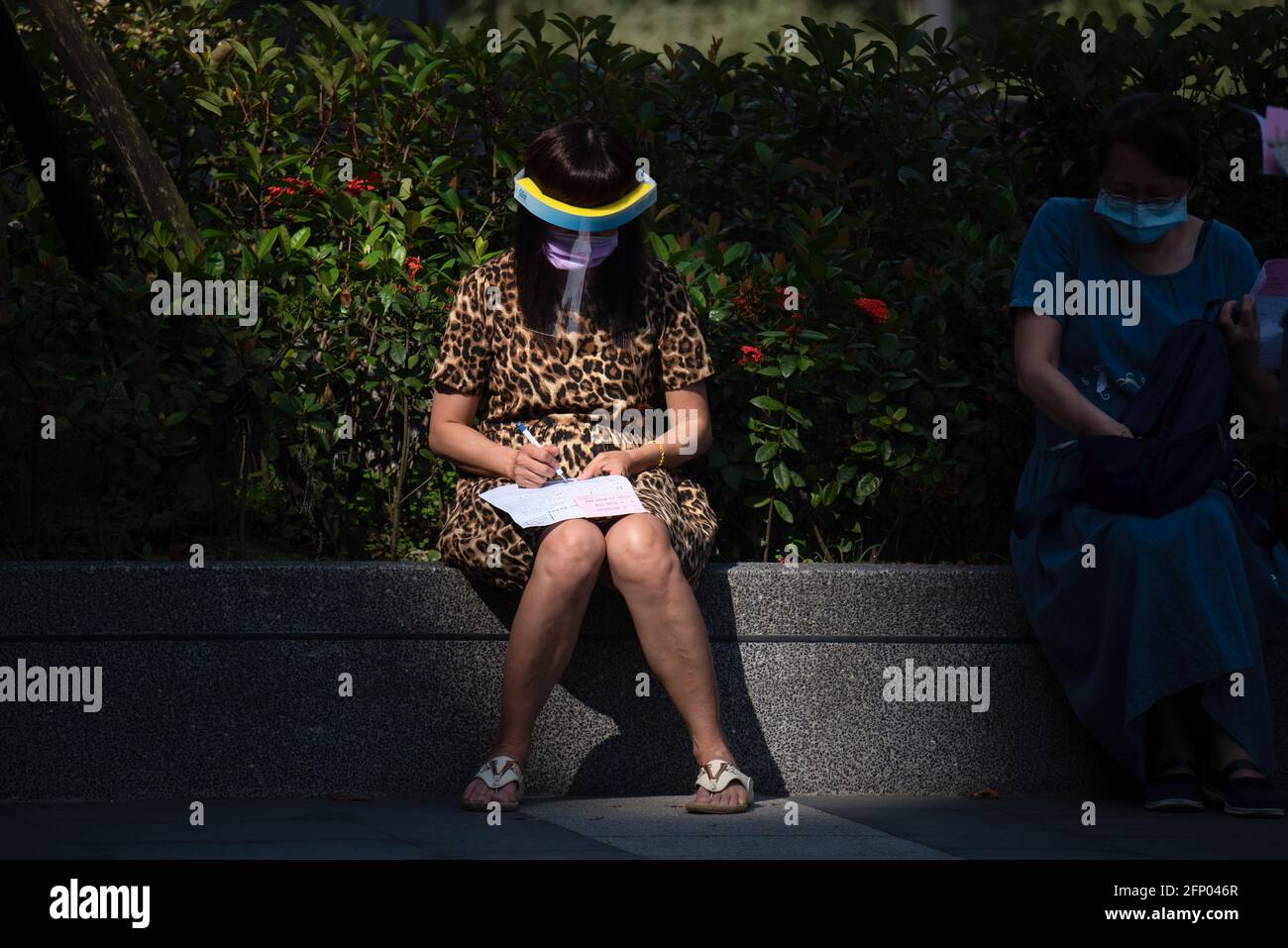 New Taipei, Taiwan. 20th May, 2021. A young woman wearing a mask and ...