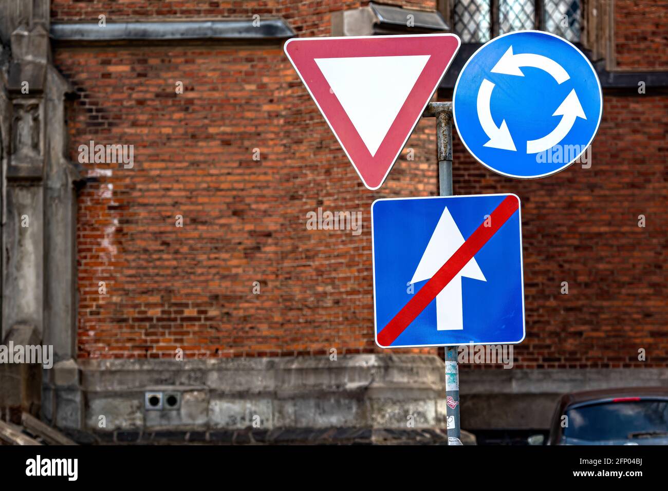 the sign is circular motion, give way and end of a one-way road on the ...