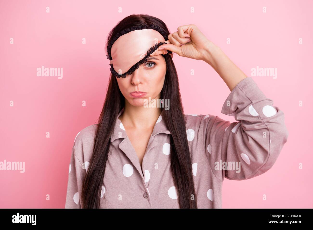 Photo of upset pretty young woman sleepwear hand arm mask cover eye ...